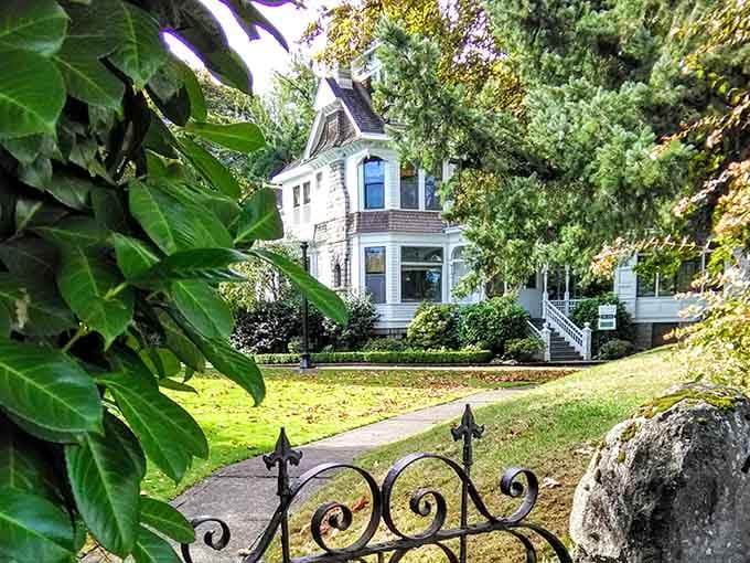 Iron gate, autumn leaves, and a Victorian mansion beyond. Salem's been holding out on the rest of Oregon.