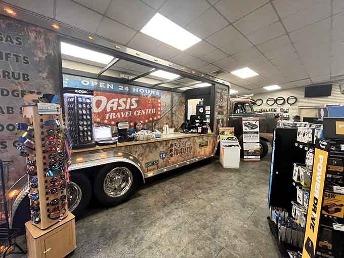 The Oasis Travel Center counter, open 24 hours and ready for whatever the road throws at you. A truck stop with serious personality.