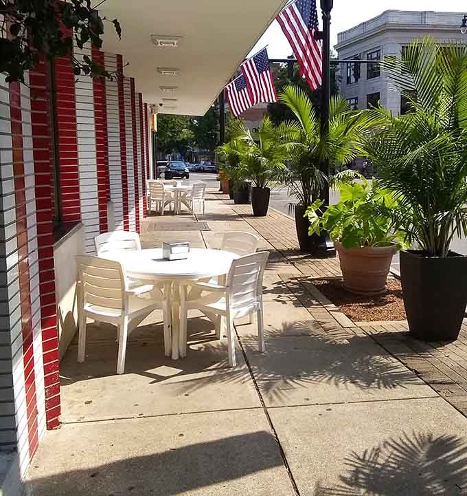 Outdoor seating where you can enjoy your five-way while watching Newport go by, American flags waving overhead like approval.