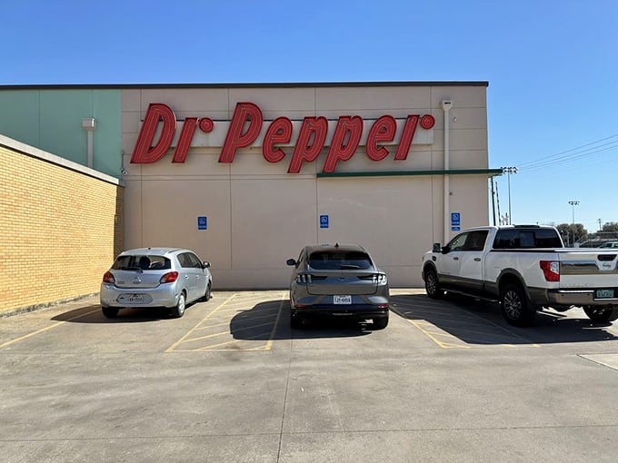 Even the parking lot announces itself with that giant retro Dr Pepper sign, because in Waco, subtlety was never really the point.