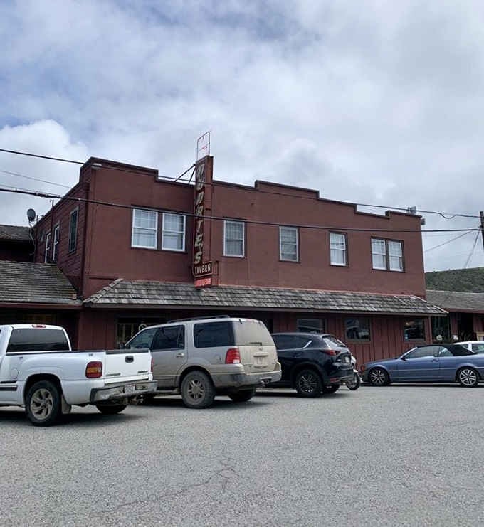 Parked cars filling the lot on a cloudy afternoon. At Duarte's Tavern, a full parking lot is always a good sign.