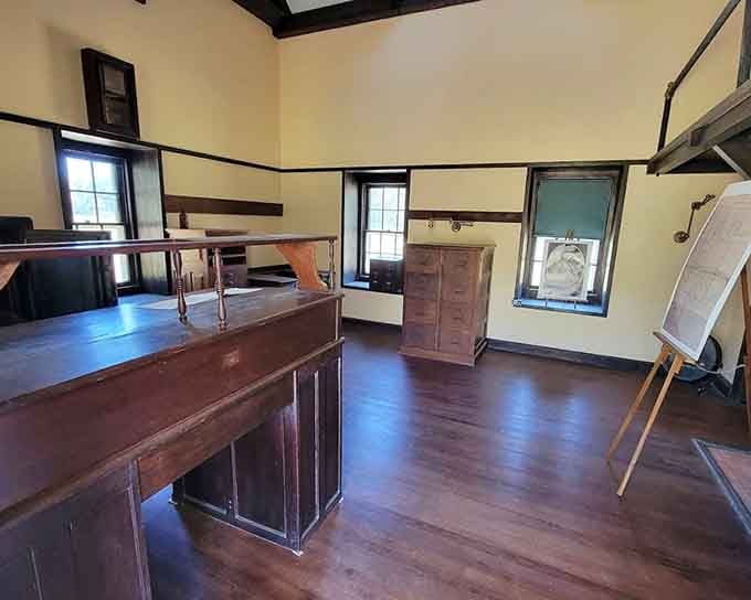 Dark wood desks and warm yellow walls inside the Tabby House feel surprisingly ready for business.