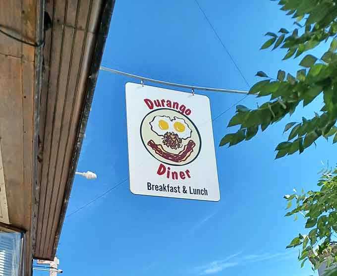 That cheerful egg-and-bacon face grinning down from a Colorado blue sky is basically the universe telling you to go inside.