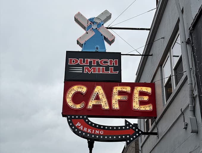 That windmill sign lit up with marquee bulbs is the kind of landmark that makes you slow down and smile.