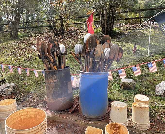 Well-worn shovels standing at attention, each one a veteran of countless successful digs at the mine.