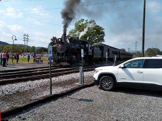 The steam locomotive rolls right through the parking lot, reminding everyone exactly who the real star of the show is.