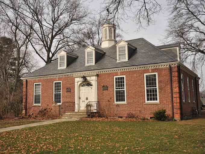 The Fairfield Historical Society building wears its Georgian brick exterior like a well-tailored suit, timeless and completely sure of itself.
