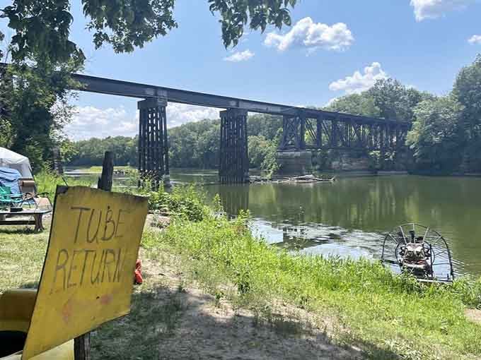 The hand-painted "Tube Return" sign beside the old iron bridge is the most satisfying finish line you'll ever see.