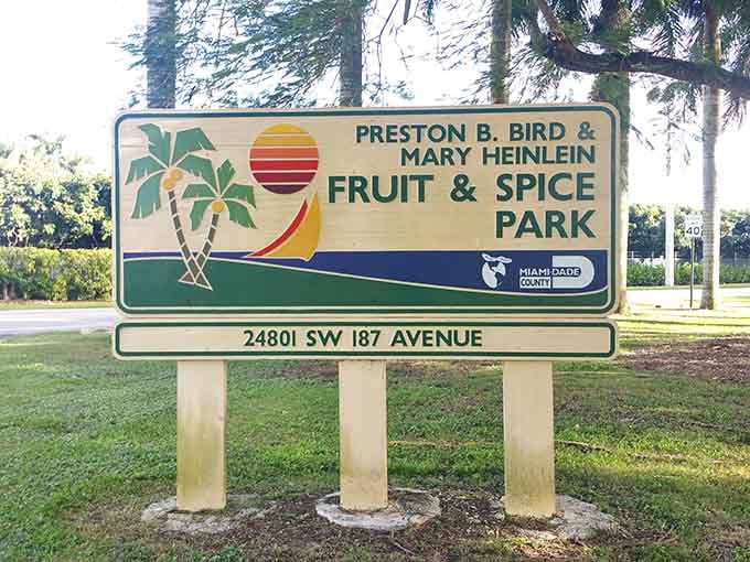 The Preston B. Bird and Mary Heinlein Fruit & Spice Park sign marks the entrance to something genuinely extraordinary in Homestead.