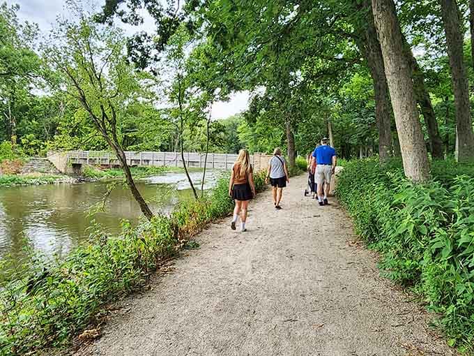 Families stroll together along the creek, proving the best adventures don't require passports or complicated planning.