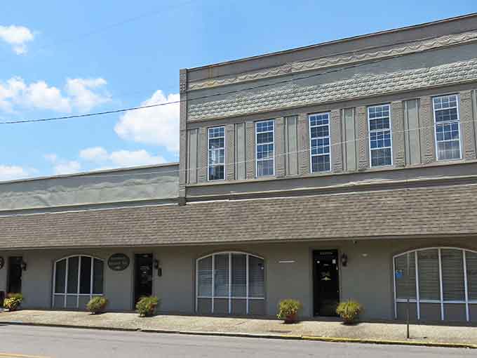 Ornate terracotta detailing crowns this commercial building's upper facade like architectural jewelry, proof that Gadsden's builders once had serious ambitions and the skills to match.