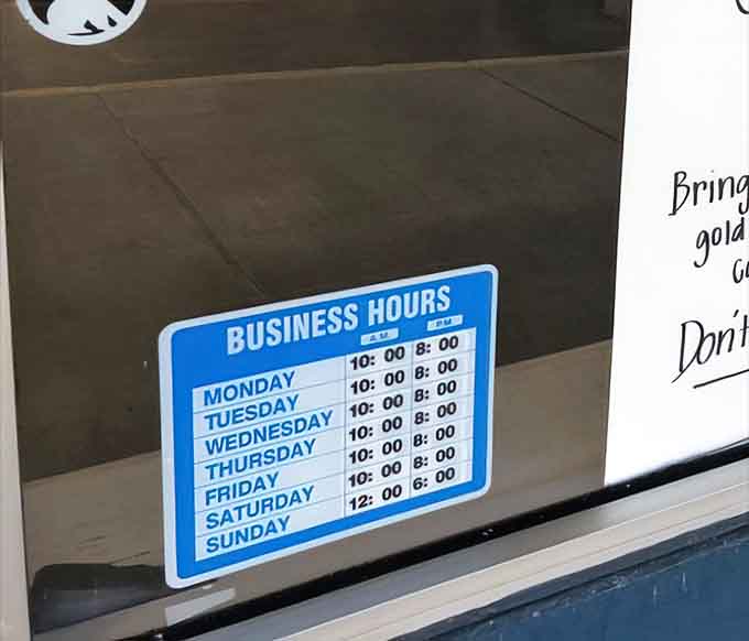 Business hours posted clearly, because even treasure hunters need to know when the hunt begins and ends.