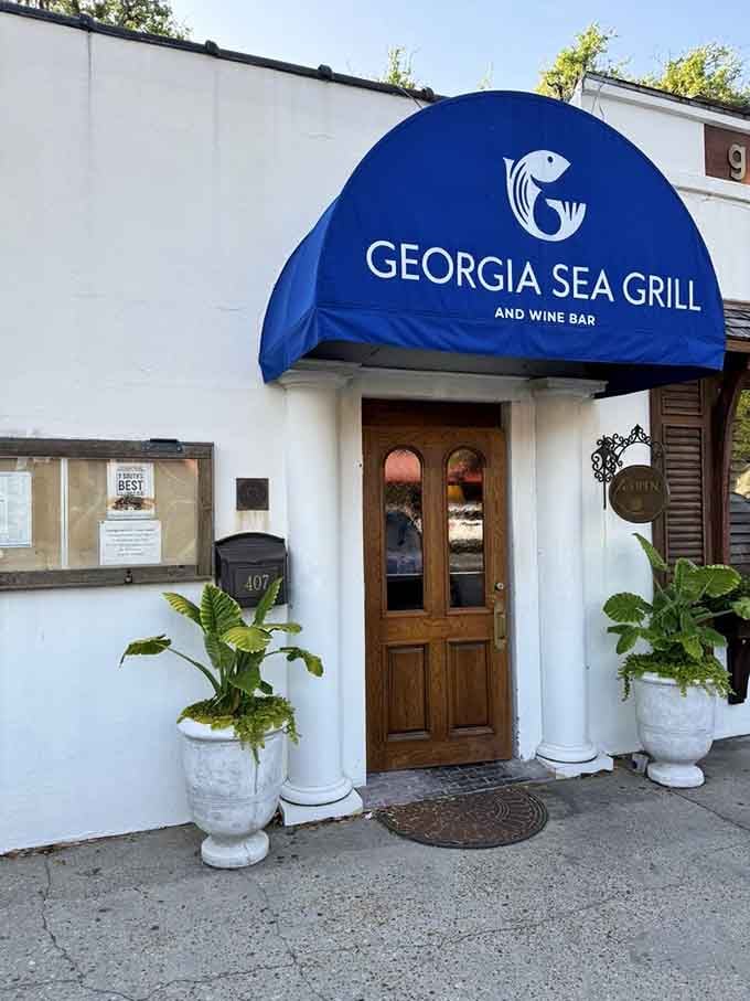 That bold blue awning and warm wooden door say one thing clearly: something worth your time is happening right behind it.