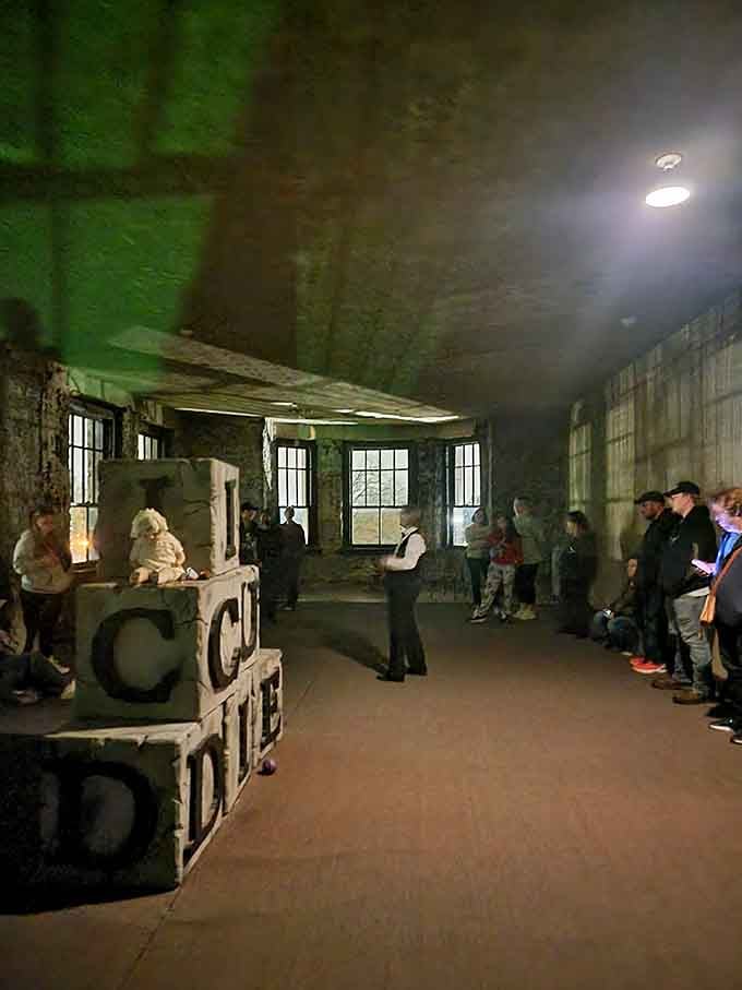 The tour winds through industrial basement areas where old equipment creates shadows that play tricks on even the bravest visitors.