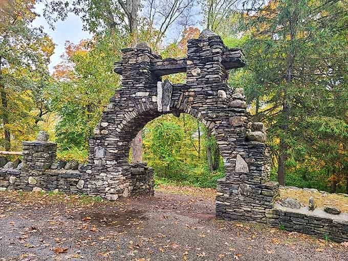 A stone archway straight out of a fairy tale, standing in the Connecticut woods like it owns the place. It does.