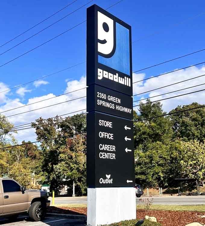 The tall outdoor sign at Green Springs Highway stands like a beacon, quietly announcing that great deals are always just one turn away.