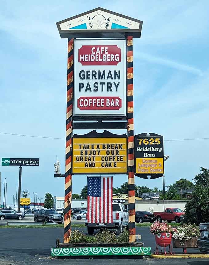 The roadside sign promises coffee and cake, a simple offer that somehow feels like the best deal in town.