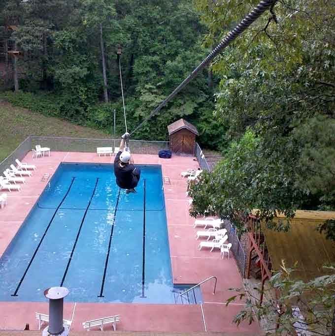 A zip line ending at a swimming pool combines two thrills into one spectacular splash that'd make any kid jealous.