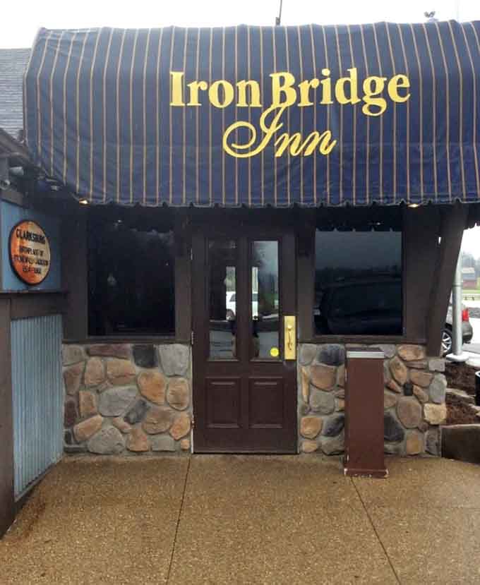 That striped navy awning and stone entrance say one thing clearly: something worth remembering is waiting just inside those doors.