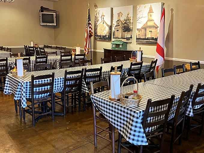 Long communal tables draped in classic checks, flanked by American and Alabama flags, this room was built for gathering and good eating.