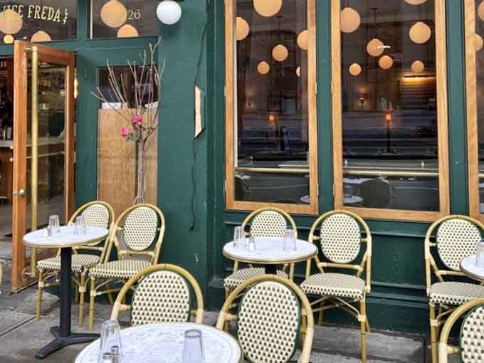 Wicker bistro chairs on a SoHo sidewalk. Somehow, this little outdoor setup makes the whole city feel manageable.