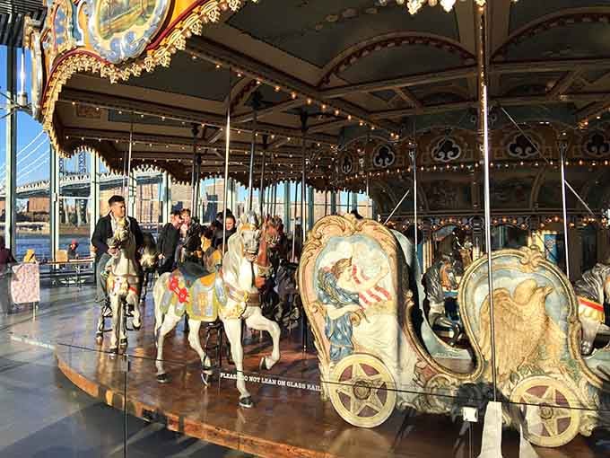 A hand-carved chariot beside a white horse, both dressed for a party that started a hundred years ago.