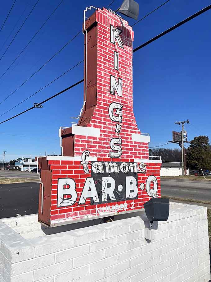 That vintage roadside sign shaped like a brick chimney has been pointing hungry travelers in the right direction for a very long time.