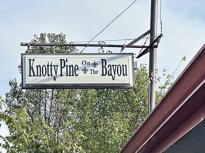 One sign, one fleur-de-lis, and a promise that something genuinely special waits just beyond the door.