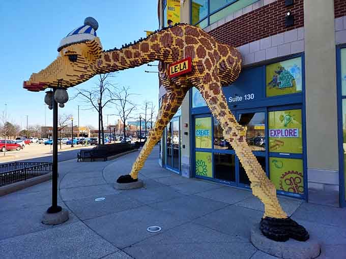 This towering giraffe welcomes visitors with the kind of enthusiasm only achievable through thousands of yellow bricks.