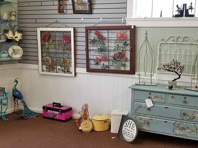 Painted window frames, a powder blue dresser, and a "She Shed" sign that speaks directly to the soul.