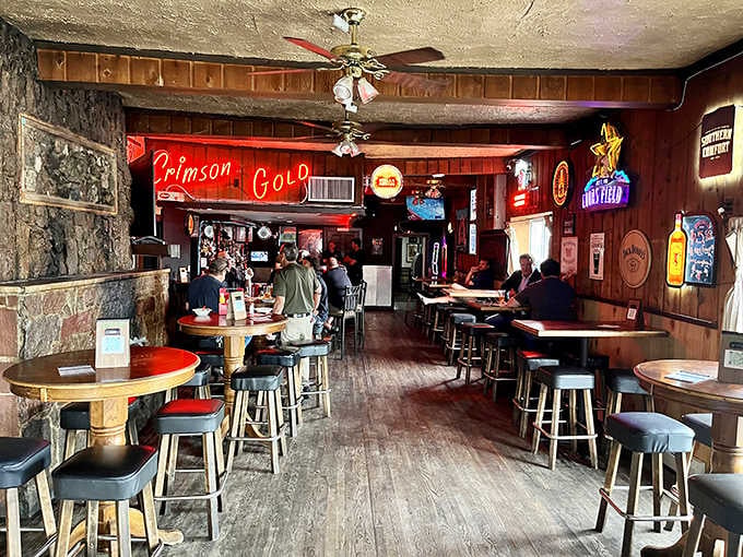 The main bar room at Lincoln's Roadhouse glows with neon signs and the kind of lived-in warmth money can't buy.