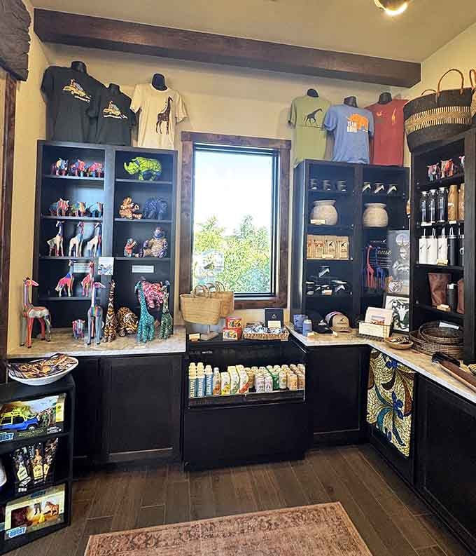 Giraffe figurines, safari tees, and colorful keepsakes fill the gift shop shelves, because of course you're taking something home from this place.