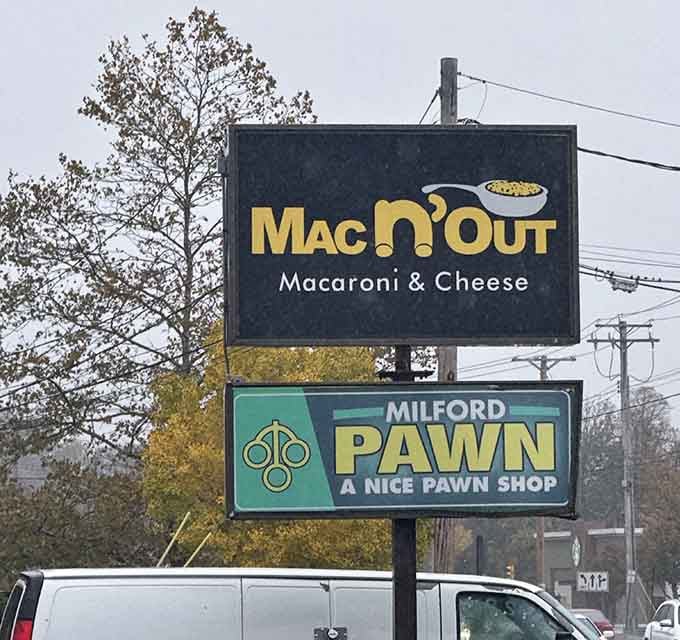 The roadside sign beckons hungry travelers like a cheesy lighthouse guiding ships safely to delicious harbor ahead.