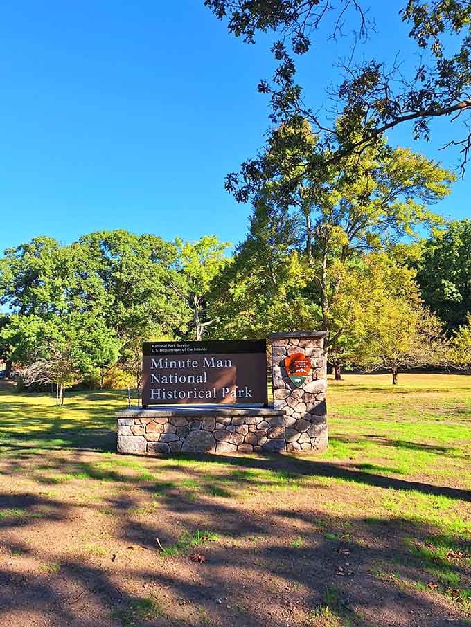 The park entrance beckons visitors into America's revolutionary past, where ordinary landscapes hold extraordinary stories.