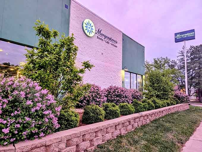 Purple blooms, a warm glow, and a sign that promises books and coffee. Yes, please.