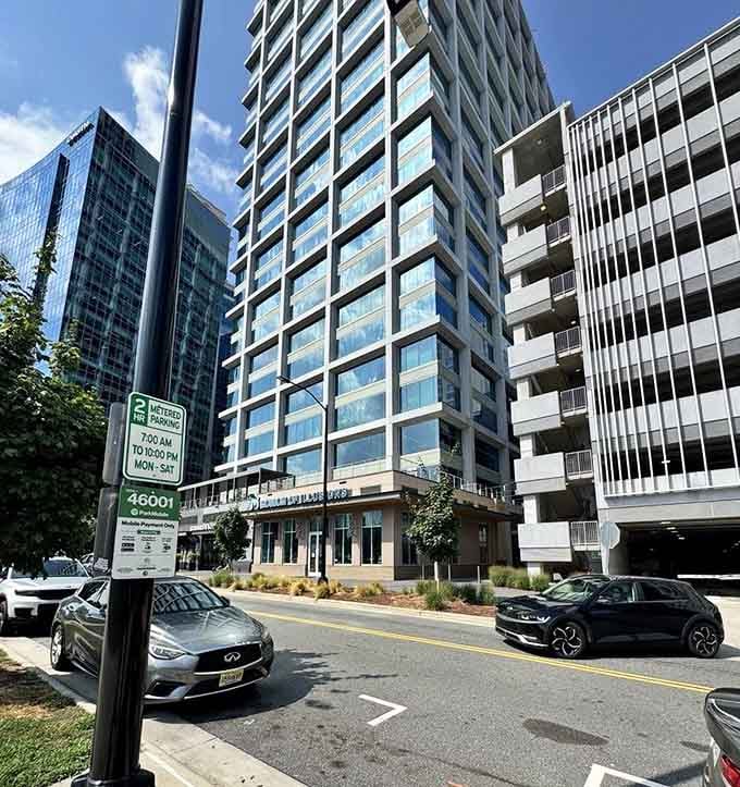 Right there on a Charlotte city street, tucked between towers of glass and steel, the most wonderfully strange building in town.