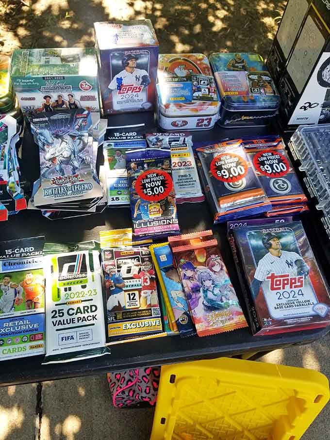 Topps 2024 baseball packs, Yu-Gi-Oh sets, and Panini cards stacked together, because the thrill of opening a pack never really gets old.