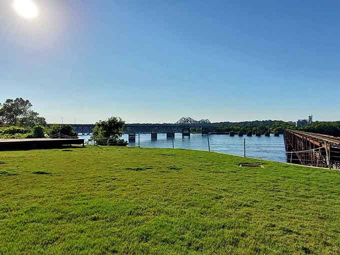 Stone steps through lush greenery lead you right to the water's edge, where the bridge tells its story best.