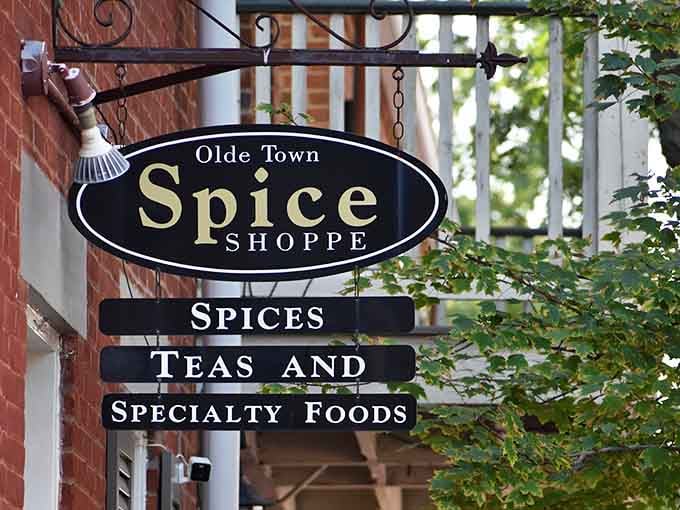 The Olde Town Spice Shoppe sign says spices, teas, and specialty foods. Three words, zero disappointments.