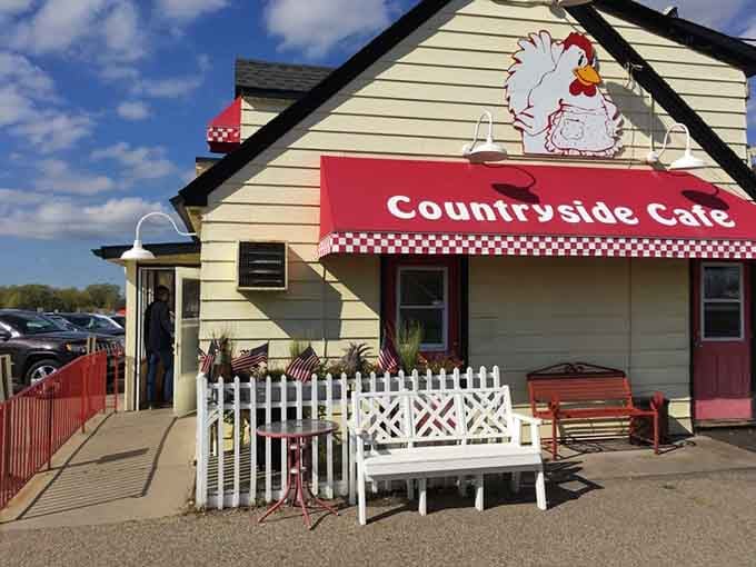 The white picket fence and red bench outside invite you to sit, relax, and anticipate the feast ahead.