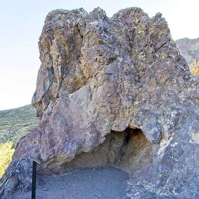 Ancient volcanic rock carved into a natural alcove, a reminder that this land has been telling stories for millennia.