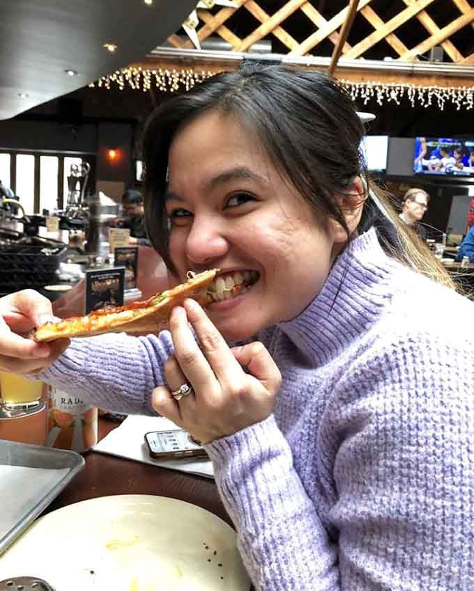 That smile says everything. Great pizza has a way of making the whole world feel a little bit better.