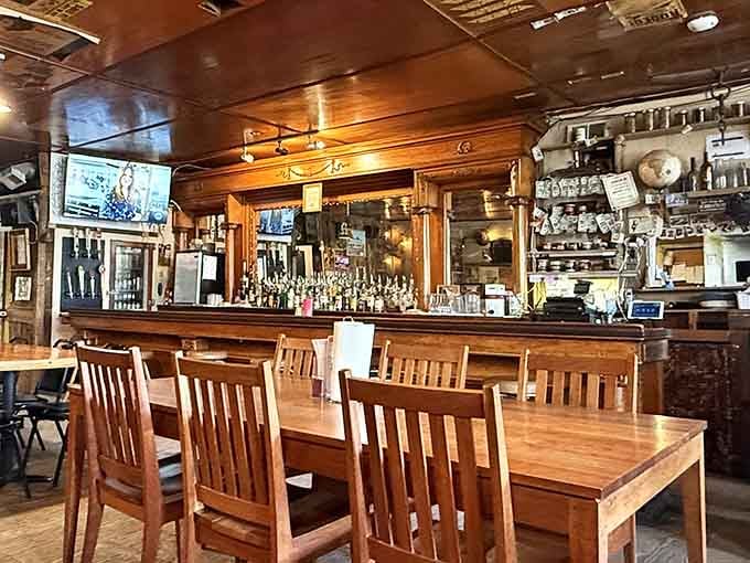 That bar, with its beautiful back mirror and rows of bottles, looks like it was built to outlast everything around it.