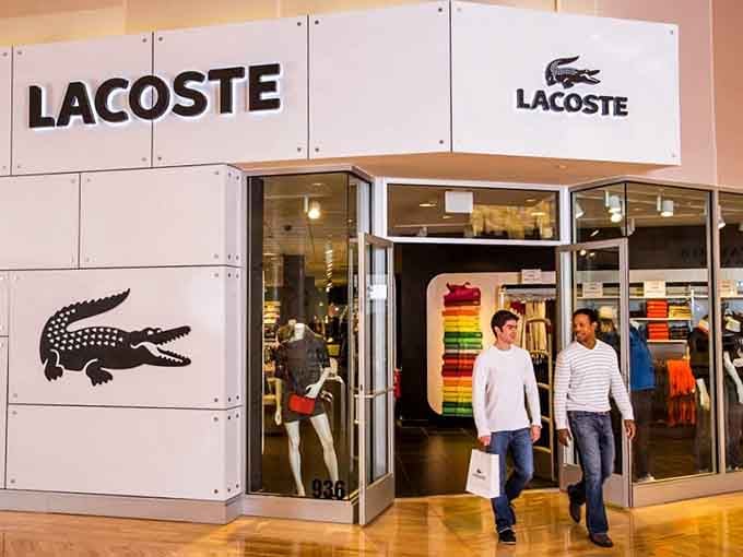 Lacoste's crisp white storefront and signature crocodile prove preppy never really goes out of style.