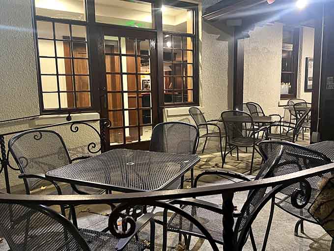 The outdoor patio at night, quiet and candlelit, is where good conversations go to become great ones.