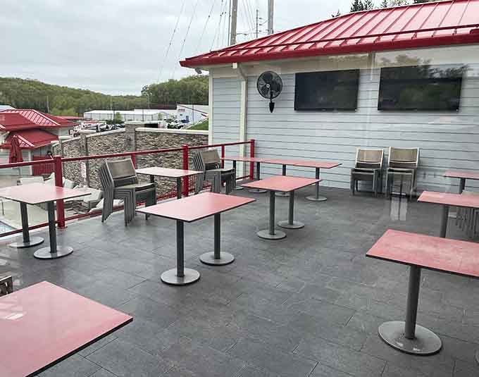 Red tables, open sky, and fresh air, the outdoor patio at Redhead is where summer afternoons belong.