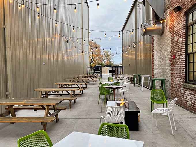 Outdoor seating with string lights overhead, because sometimes the best dining room has no roof at all.