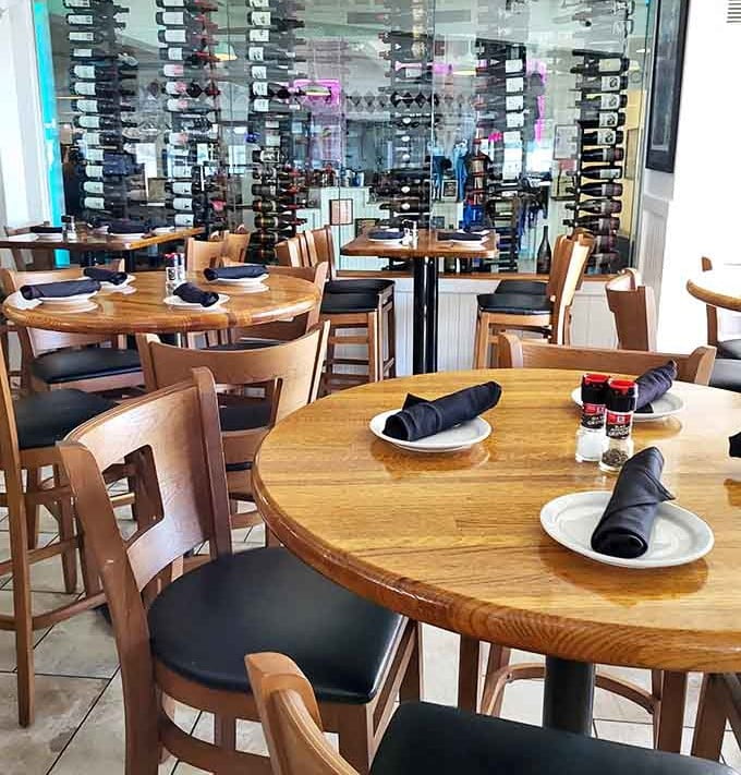 Round tables, black napkins, and a wine display that quietly says this place means it.