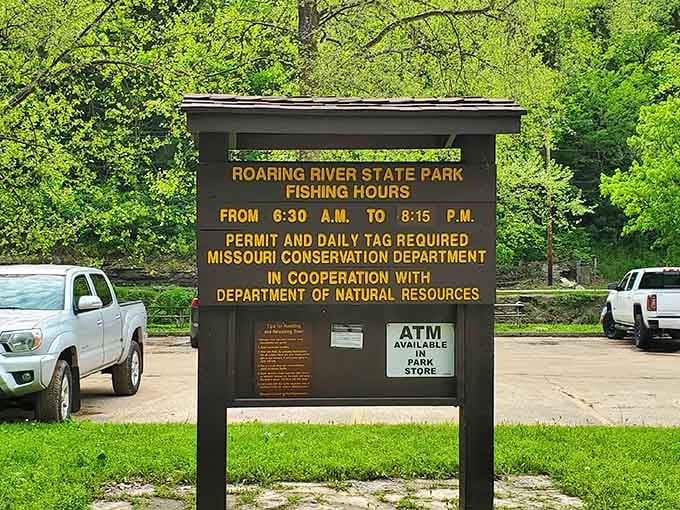 The fishing hours sign at Roaring River means business. Six-thirty in the morning, permit in hand, trout season is not waiting for you.