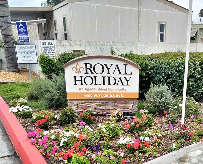 Flowers at the entrance and a proper sign, Royal Holiday on West Florida Avenue means business.